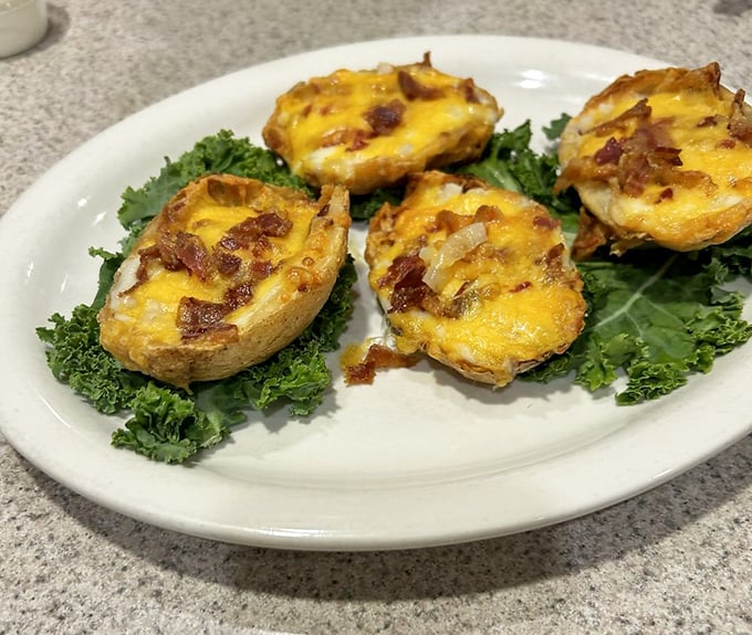 Loaded potato skins: where bacon and cheese find their higher purpose. These golden boats of deliciousness are worth every calorie.