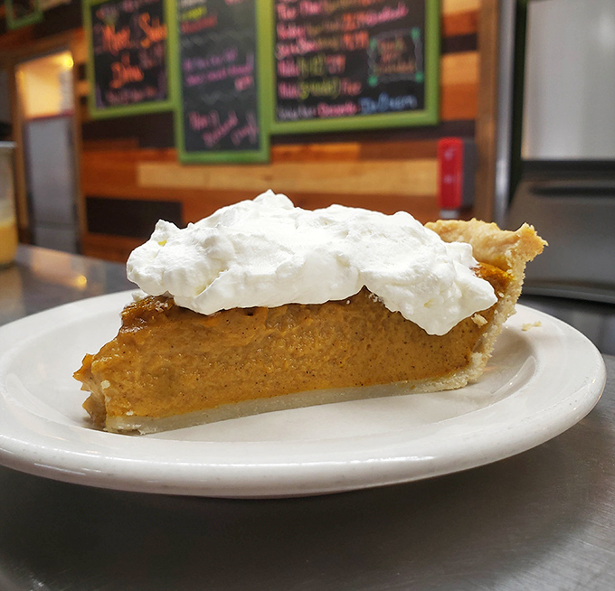 Pumpkin pie topped with a cloud of whipped cream so perfect it makes you wonder why anyone bothers with fancy desserts.