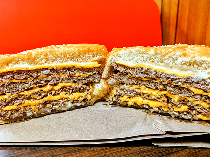 Not all heroes wear capes&mdash;some come stacked four patties high with cheese layered between each one. This isn't a meal; it's a monument to American excess.