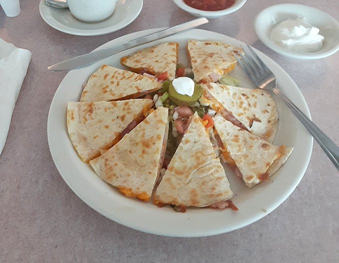 This quesadilla isn't just cut into triangles—it's arranged like a sunburst of melty cheese and savory fillings that makes sharing both necessary and slightly tragic.