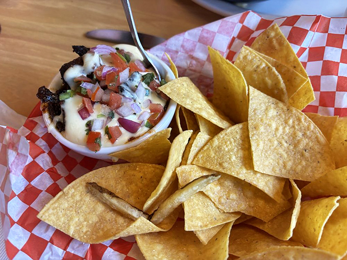 Even the queso dip tells a story here &ndash; creamy, slightly smoky, and demanding to be scooped up with those perfectly crisp tortilla chips.