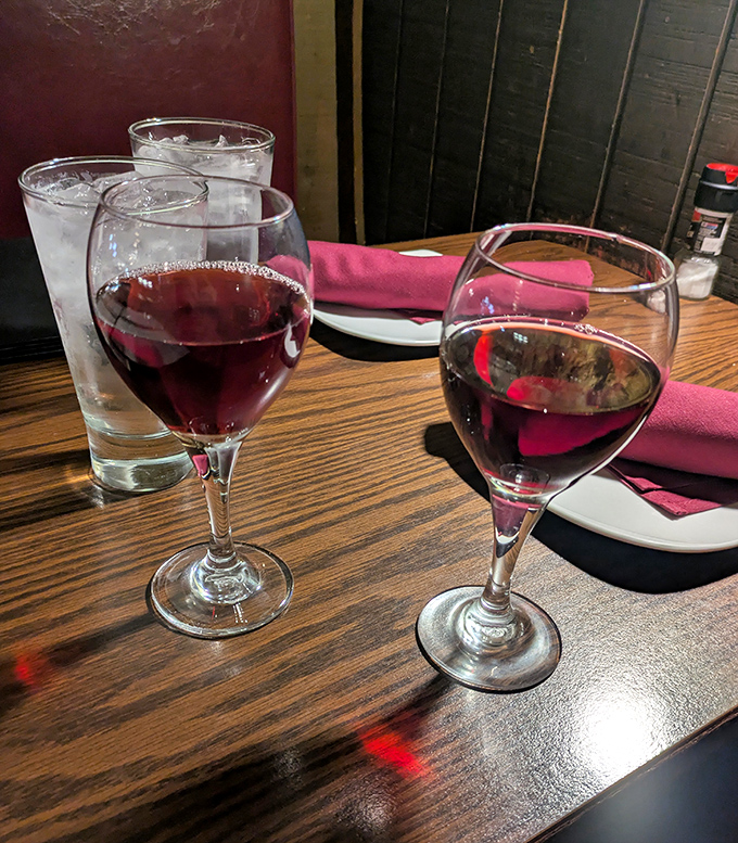 Red wine in rustic glasses &ndash; because historic buildings and fine dining deserve a proper toast to the past.