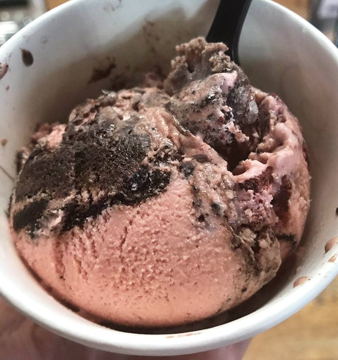 Ice cream that makes adults forget their dignity. One spoonful of this red devil cheesecake concoction, and suddenly calories become theoretical physics—complicated and best ignored.