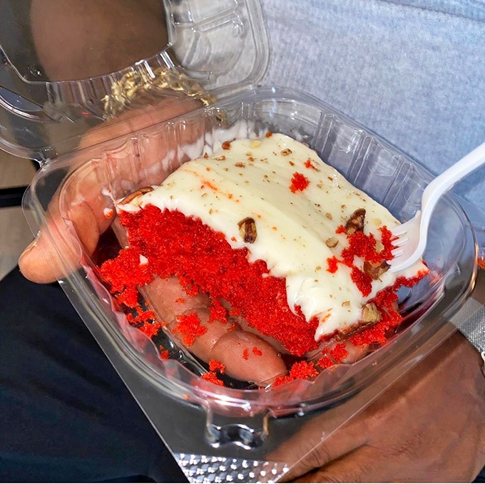 Red velvet cake so vibrant it could stop traffic. The cream cheese frosting practically begs for your fork to dive right in.