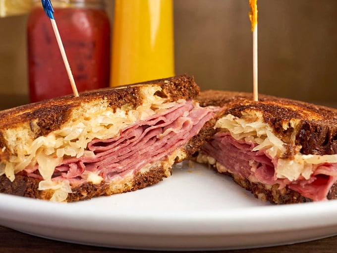 A proper Reuben should require both hands and make you forget your table manners. This one passes the test with flying sauerkraut.