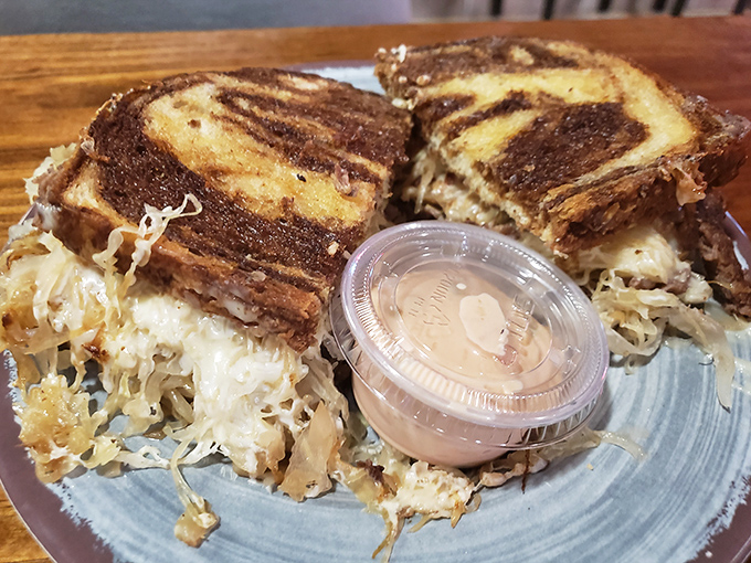 The Reuben arrives dressed to impress, with sauerkraut and Swiss playing their supporting roles to perfection.