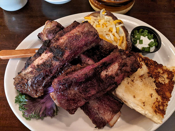 Ribs so tender they practically surrender to your fork. That charred exterior is hiding meat that falls off the bone with a whisper.