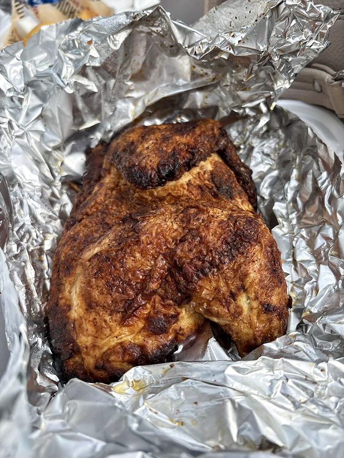 Foil-wrapped chicken that's been kissed by smoke until it surrenders all pretense of being ordinary poultry.