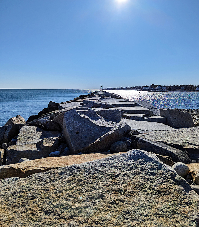 The jetty at Rye Harbor stretches toward the horizon like a granite pathway to adventure, inviting explorers to test their balance.