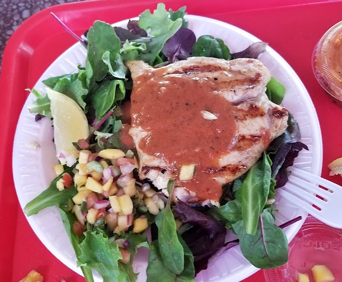 Even the salad gets the seafood treatment, with grilled fish perched atop fresh greens and a vibrant salsa that brings California sunshine to your plate.