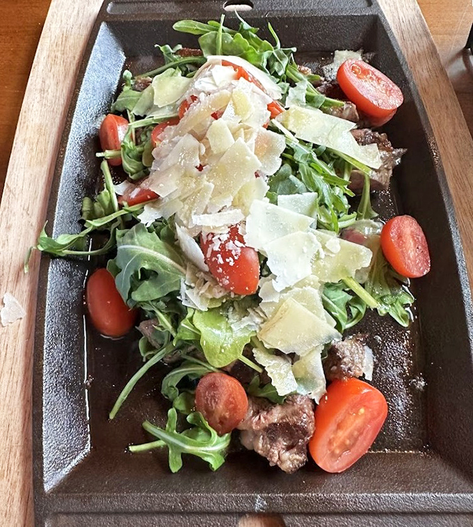 This salad isn't just eating your vegetables – it's a celebration of fresh greens, cherry tomatoes, and shaved parmesan that makes virtue feel like indulgence.