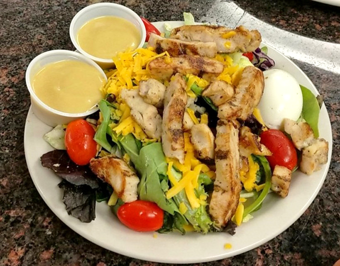 Even the salads here mean business. Grilled chicken, fresh greens, and two dressing options because in Texas, choice isn't just appreciated&mdash;it's expected.