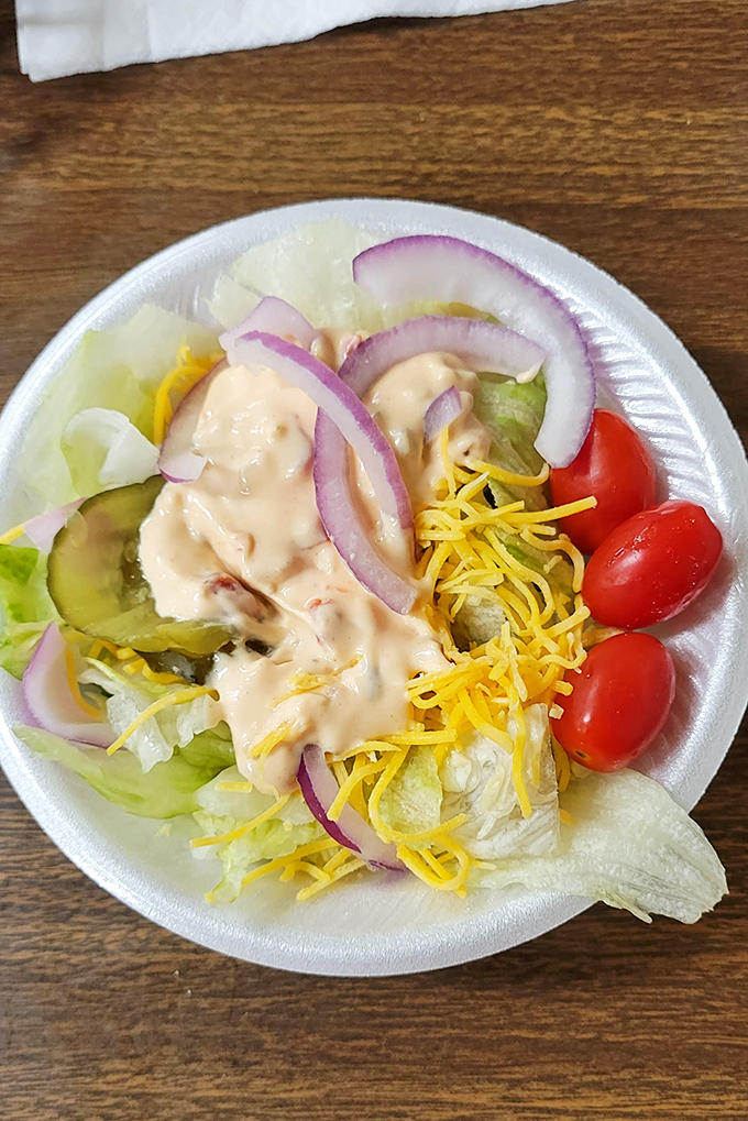 Even the salads at Top Hat get special treatment &ndash; crisp, colorful, and dressed just right, proving vegetables can hang with the smoky superstars.