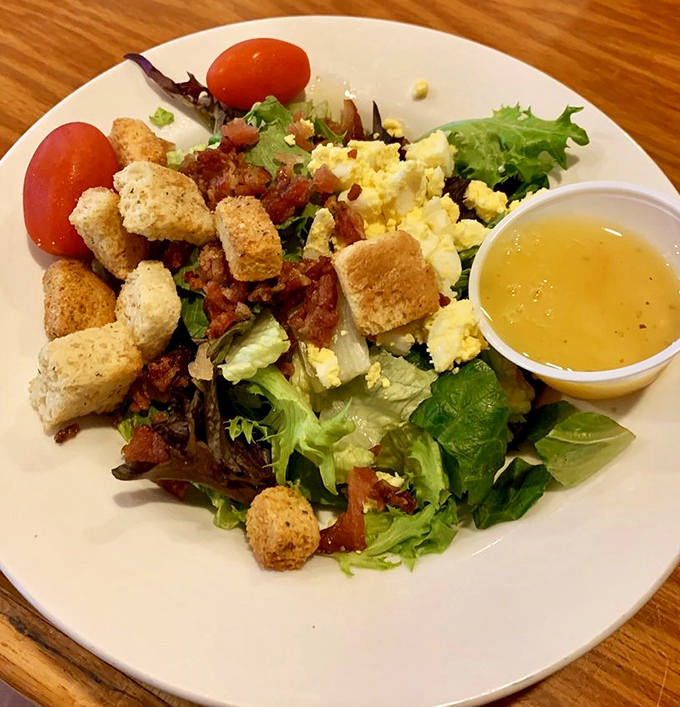 A salad that doesn't apologize for being healthy, because those croutons and bacon bits are staging a delicious rebellion.