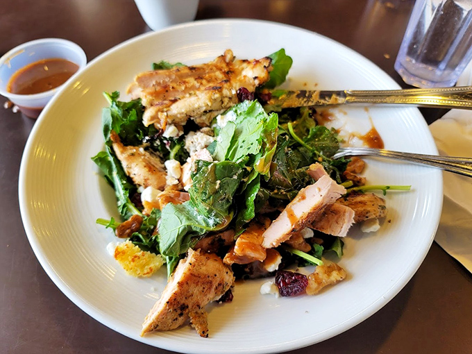 Even salads get the royal treatment here&mdash;grilled chicken, fresh greens, and enough flavor to make you temporarily forget about the dessert case.