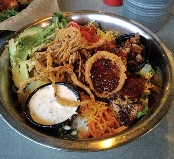Not just a salad, but a metal platter of possibilities. Those crispy onion strings aren't just a topping&mdash;they're the crown jewels.