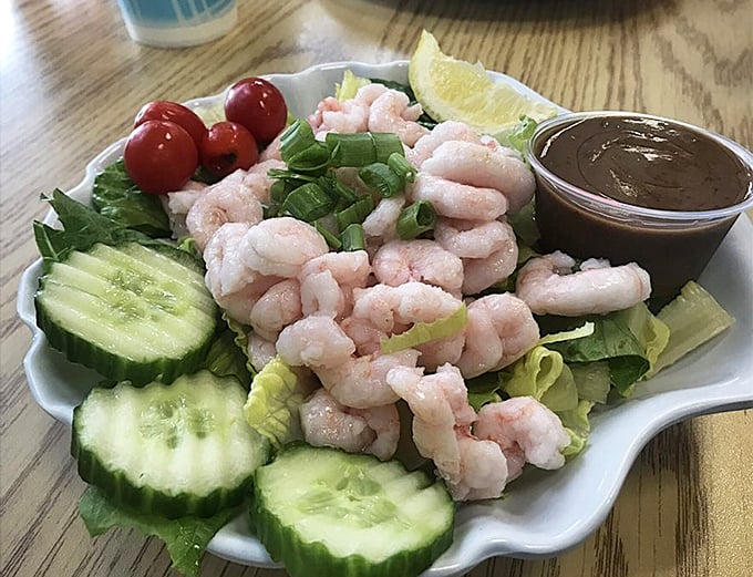 A shrimp salad that makes eating greens feel like cheating. Those plump little crescents of the sea are having a party with cucumber and tomato.