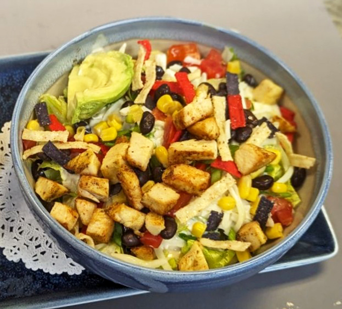A salad bowl that says, "Yes, I'm being healthy-ish" while secretly being just as indulgent as everything else. Those avocado chunks are calling your name.