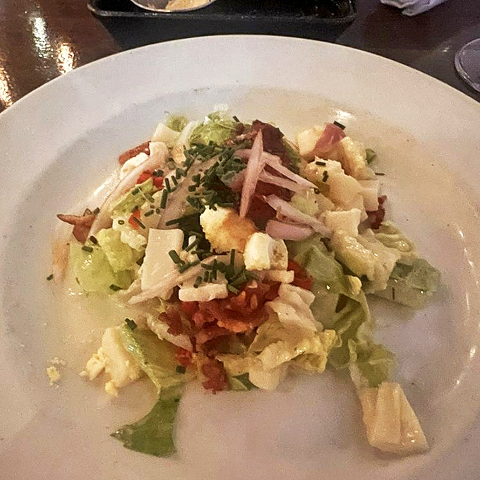 A salad that doesn't pretend to be health food. When ham, cheese, and eggs join the party, lettuce is just along for the ride.