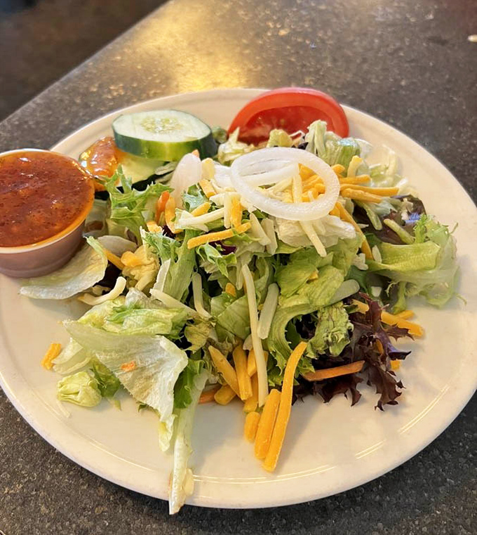 A salad that actually looks like it wants to be eaten. Fresh greens, vibrant vegetables, and just enough cheese to remind you that you're still in the Midwest.