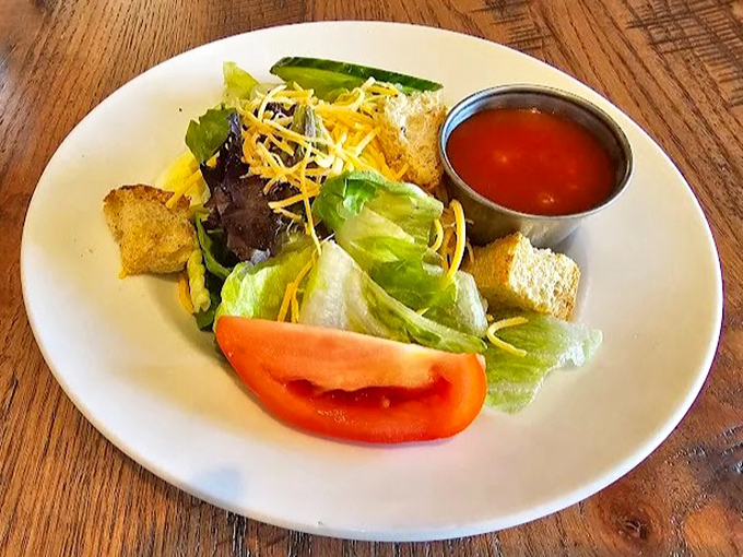 Even the salad looks like it's from a simpler time &ndash; when vegetables knew their place and croutons were considered a major food group.