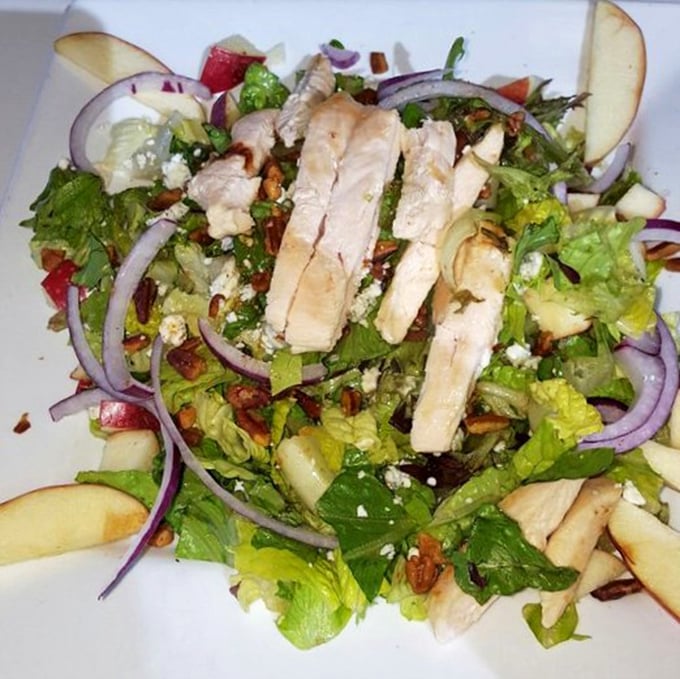 Even salads get the royal treatment here&mdash;fresh greens, grilled chicken, and crisp apples proving healthy eating doesn't have to be punishment.