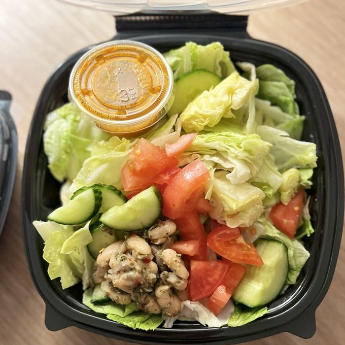 A salad that doesn't feel like punishment. Fresh greens, veggies, and seasoned chicken make healthy eating temporarily painless.