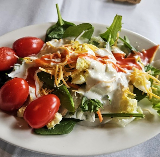 Even the salad looks like it's dressed for a special occasion, with cherry tomatoes standing guard around the perimeter.