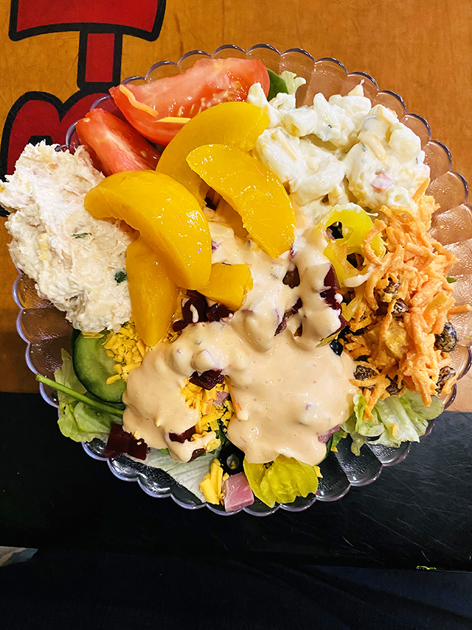 A salad that doesn't apologize for being delicious. Those peach slices aren't just garnish &ndash; they're Georgia's signature waving hello.