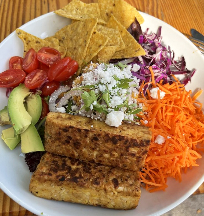 This colorful plate isn't just a salad&mdash;it's a carnival of textures and flavors where tofu is the honored guest, not the compromise.