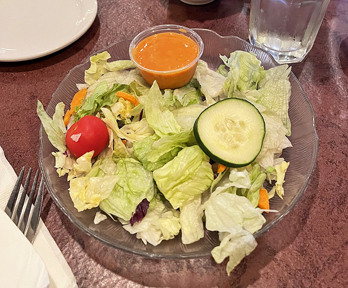 A simple house salad that knows its role &ndash; the opening act that sets the stage without stealing the spotlight from what's to come.