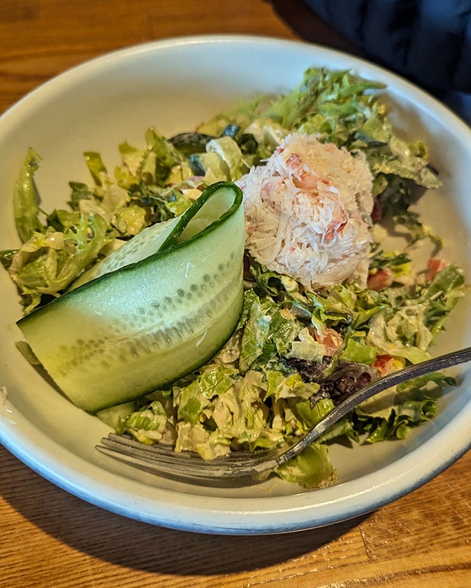 Even the salad at Lucky 13 refuses to be boring. That cucumber ribbon is dressed better than most people at the grocery store.