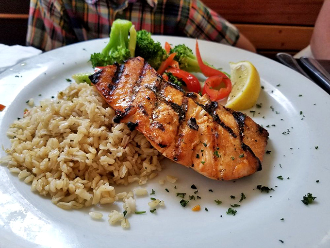 Grilled salmon that flakes at the mere suggestion of a fork, paired with rice and vegetables that didn't come from the freezer section.