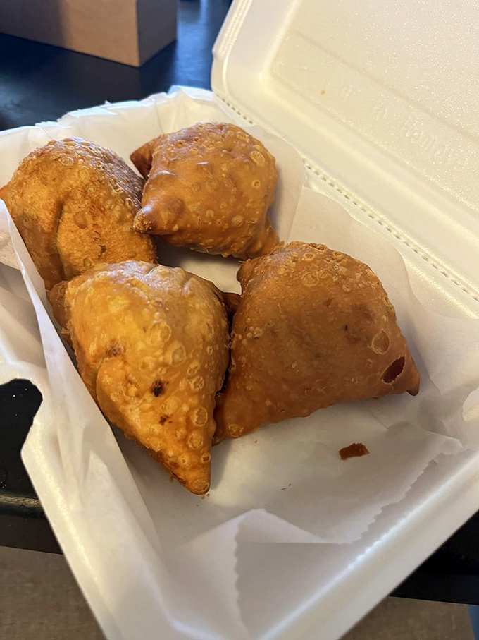 Golden-fried samosas that crackle with promise&mdash;little triangular packages containing spiced potato treasures worth crossing town for.