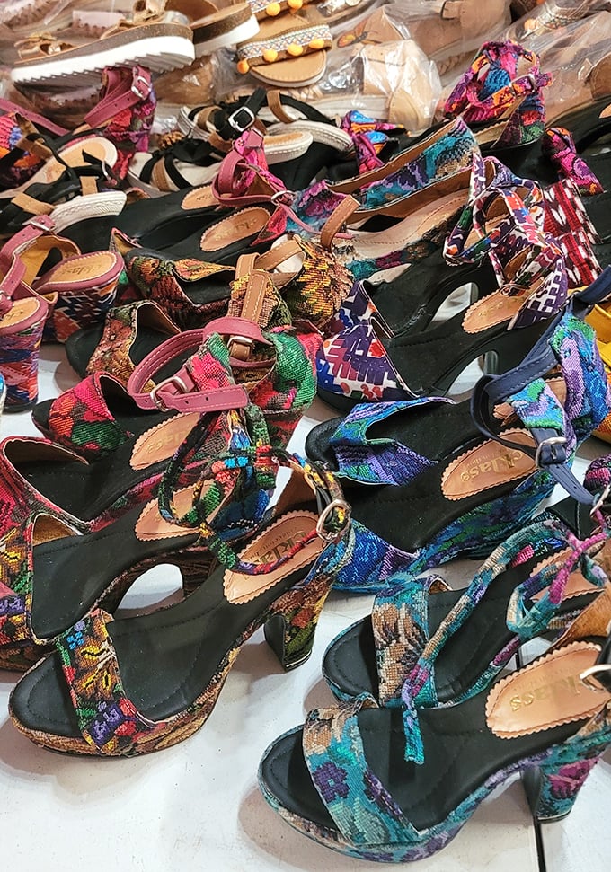 These vibrant patterned sandals aren't just footwear—they're wearable art with stories woven into every colorful stitch and strap.