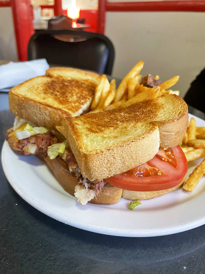 The sandwich that launched a thousand naps. Golden-toasted bread embracing its fillings like a warm hug you can eat.