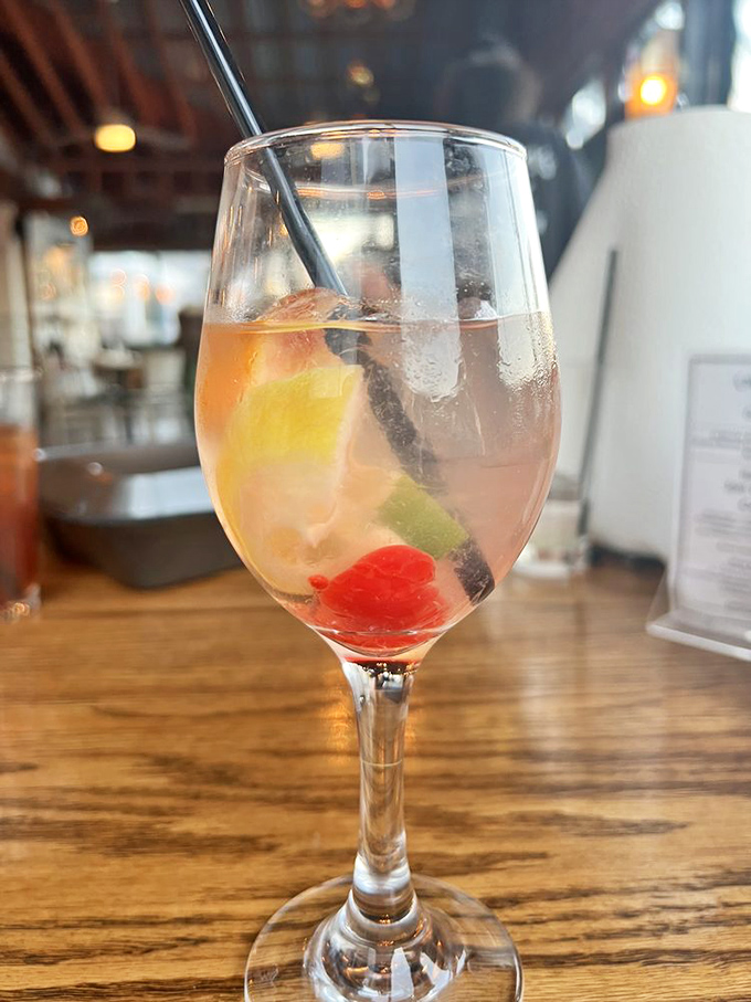 This isn't just a drink; it's a vacation in stemware. The sangria's fruity jewels promise refreshment that pairs perfectly with ocean fare.