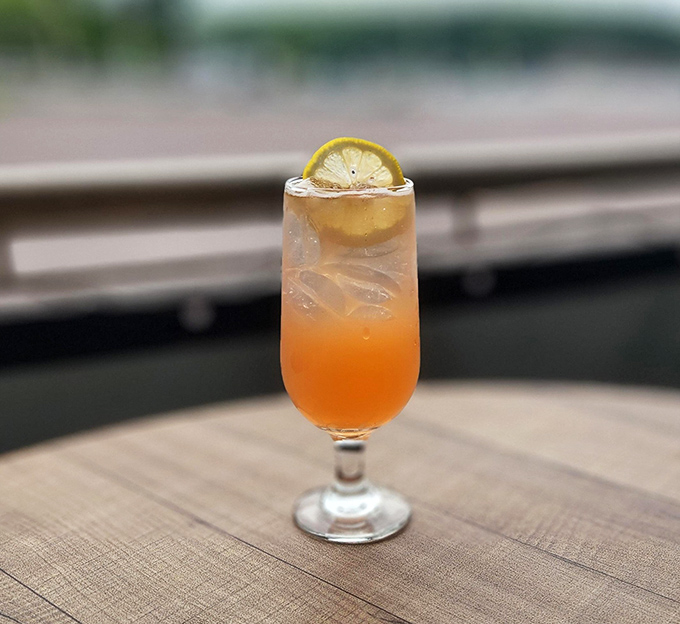 A sunset in a glass, complete with citrus horizon. This cocktail isn't just refreshing &ndash; it's what summer would look like if it decided to become a beverage.