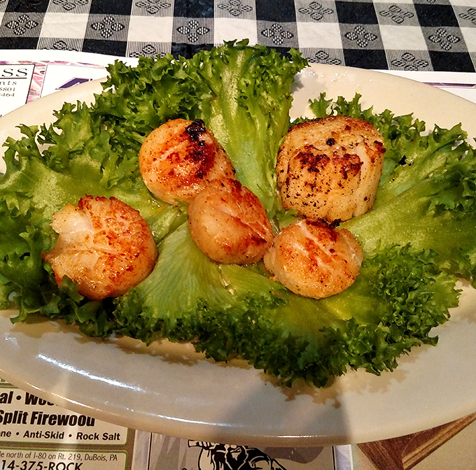 These seared scallops aren't just seafood&mdash;they're little buttery medallions of ocean perfection nestled on a bed of fresh greens.