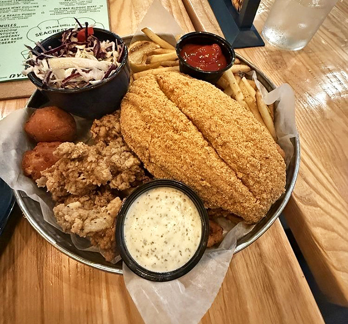 A seafood platter that's essentially an edible treasure chest from Poseidon himself, complete with golden-fried bounty and tangy dipping treasures.