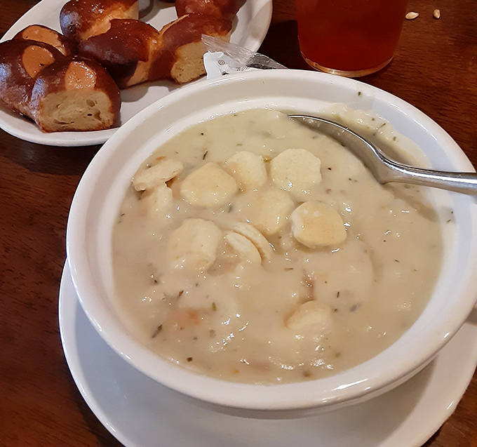 A bowl of seafood chowder so creamy and substantial it could qualify as a life raft in a storm &ndash; with pretzel rolls standing by for necessary dipping duty.