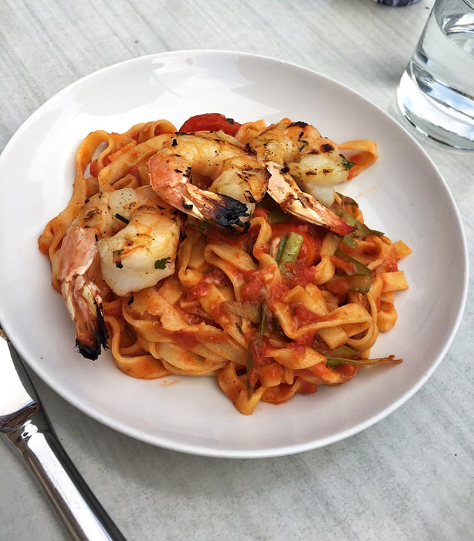 Plump shrimp nestled in housemade fettuccini with a sauce that begs for bread. No judgment if you lick the plate clean.