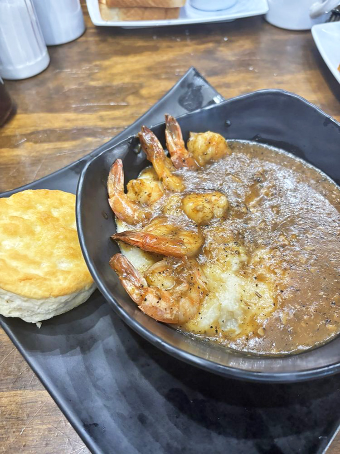 BBQ shrimp and grits with a biscuit on the side &ndash; the holy trinity of Southern breakfast that'll make you speak in tongues.