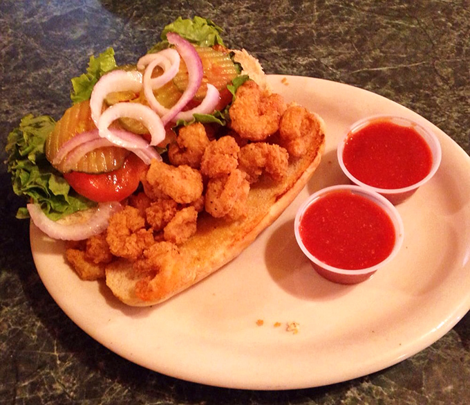 This po-boy isn't poor in any sense that matters. Crispy fried shrimp nestled in a soft roll with fresh veggies&mdash;a Gulf Coast classic done right. 