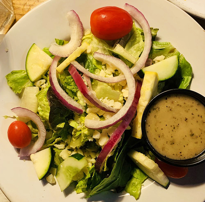 Even the side salad shows attention to detail&mdash;crisp vegetables, vibrant colors, and house-made dressing that puts most restaurant afterthoughts to shame.