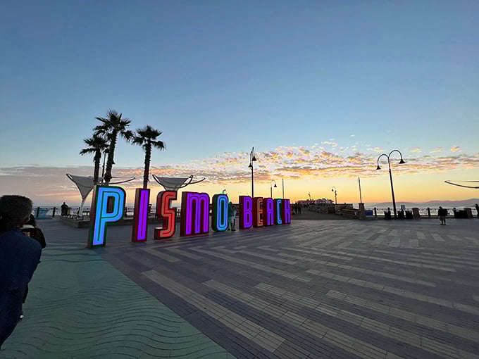 Pismo Beach's colorful welcome sign glows at sunset, promising both ocean views and retail therapy. Talk about a perfect California combo.