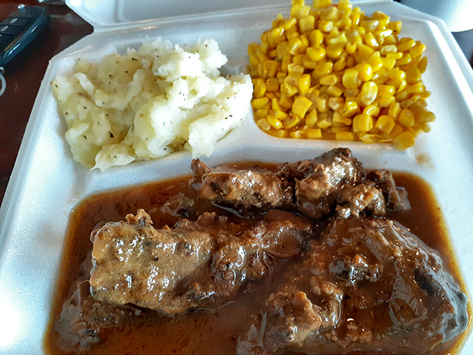These smothered pork chops aren't just swimming in gravy&mdash;they're doing the backstroke in flavor. The mashed potatoes and corn make perfect sidekicks.