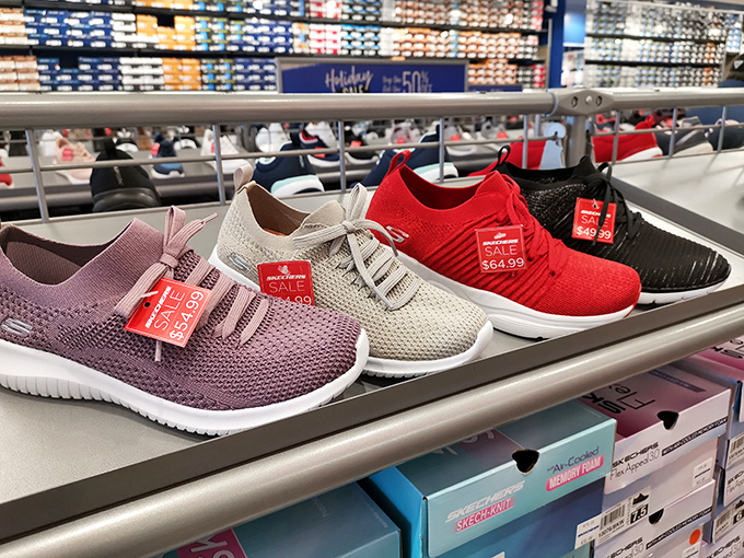 Sneaker display that makes you think, "At these prices, my feet deserve at least three new pairs." Your podiatrist would approve; your accountant might have questions.