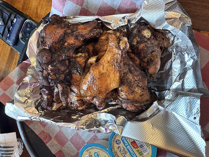 Smoked chicken that's clearly been to finishing school. That mahogany skin is the diploma in advanced smoke studies.