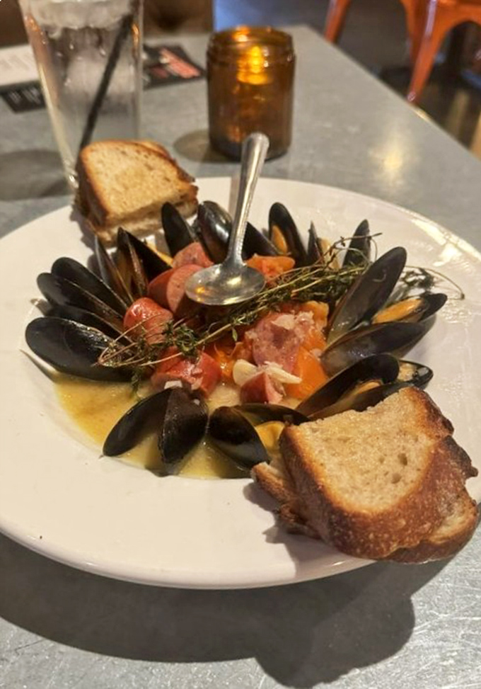 These mussels swim in a flavorful broth alongside chorizo and grilled bread&mdash;seafood that found its soulmate in smoke.